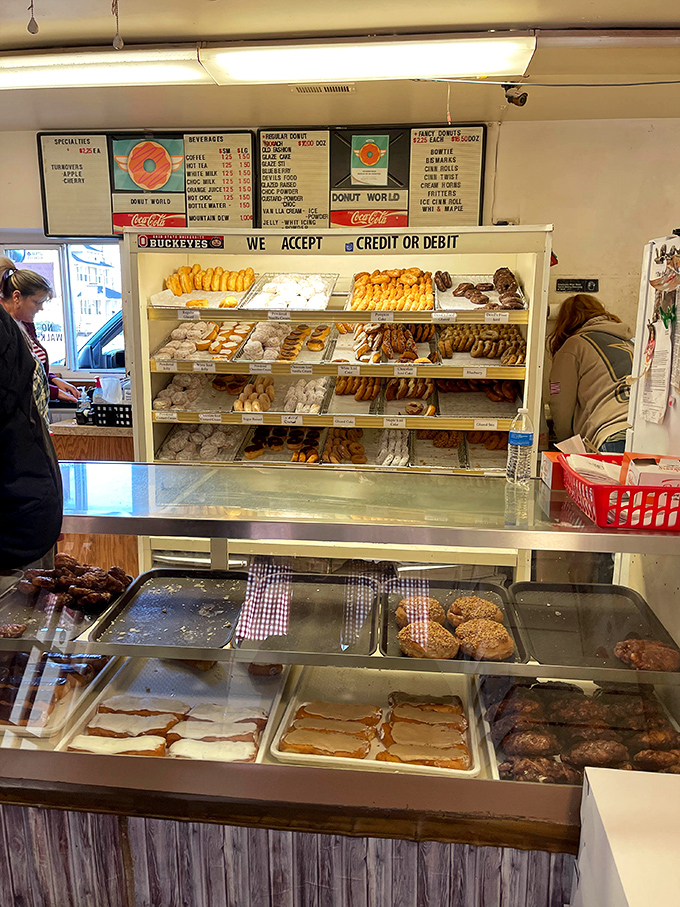 Rows of golden perfection waiting behind glass like the world's most delicious museum exhibit you can actually eat.