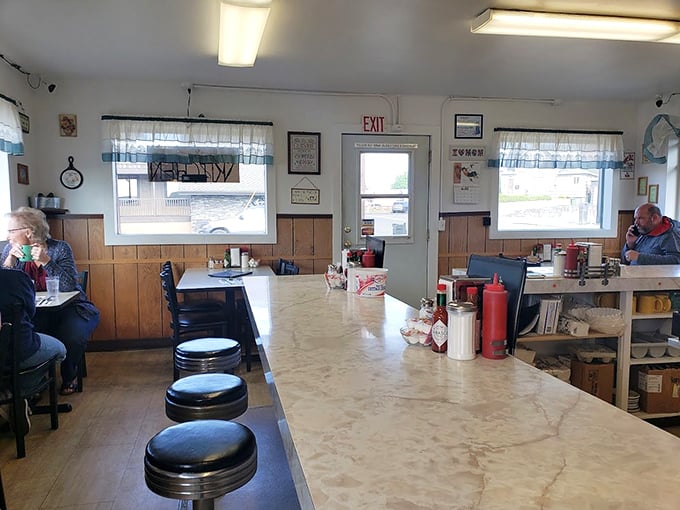 Classic diner aesthetics with wood-paneled walls and no-nonsense seating &ndash; this isn't where you come for the d&eacute;cor, but for what's sizzling in the kitchen.