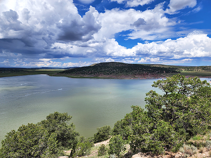 Cloud theater performs daily above Bluewater Lake, where dramatic skies and tranquil waters create nature's perfect IMAX experience.