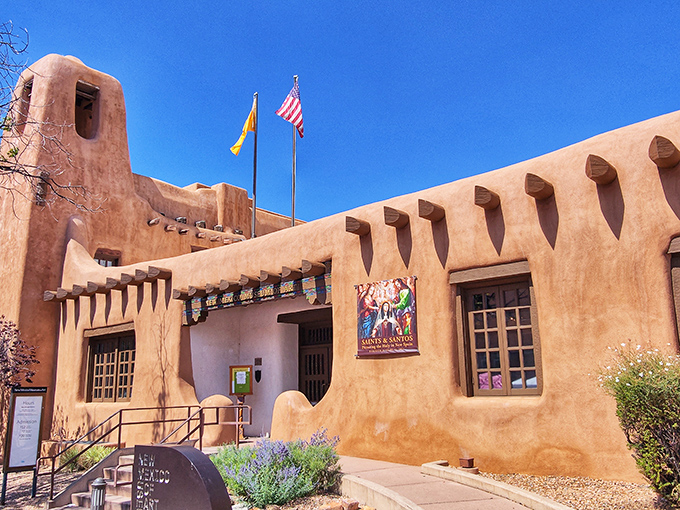 This isn't just any adobe building&mdash;it's the Museum of Art, where New Mexico's soul is displayed with the same pride as the flags above.