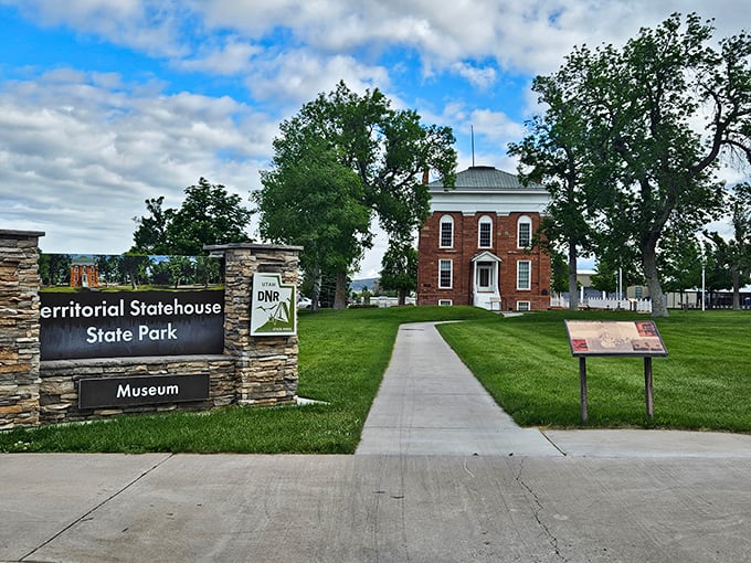 Utah's first territorial capitol stands proudly against the blue sky, a red brick testament to political ambitions that didn't quite pan out.