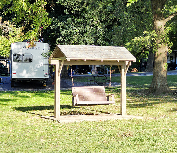 Camping's simple pleasures: a gentle swing in the shade, an RV named "Imagine," and the promise of absolutely no Zoom meetings for days.