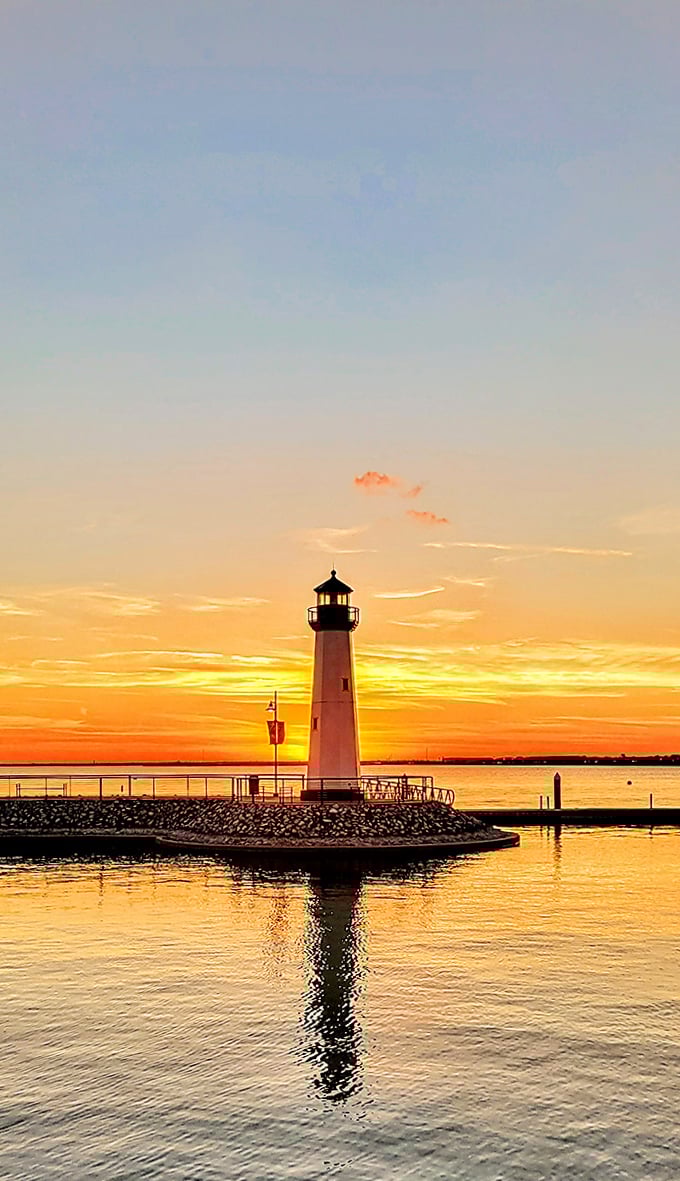 Nature's light show upstages the lighthouse itself. Even Texas sunsets know how to make a dramatic entrance.