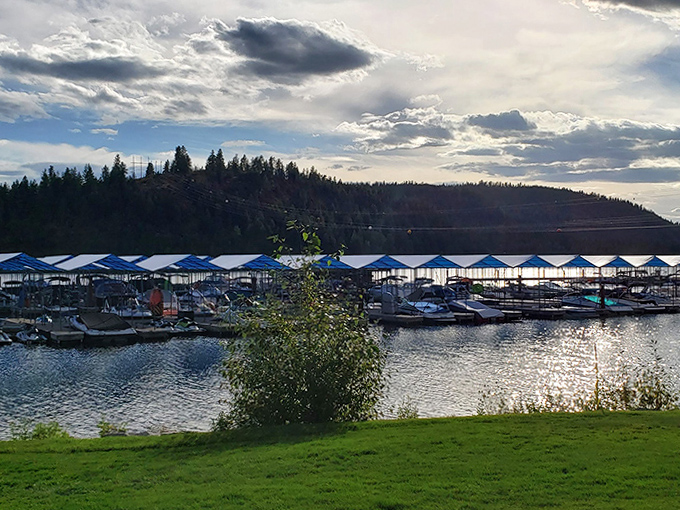 Marina slips stand ready for adventure as dramatic clouds play across the sky. Even the boats seem to be saying, "Just one more sunset before we call it a day."