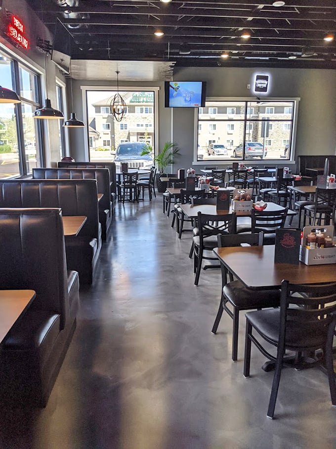 Clean lines, comfortable booths, and ample natural light create the perfect backdrop for the meat-centric drama about to unfold on your plate.