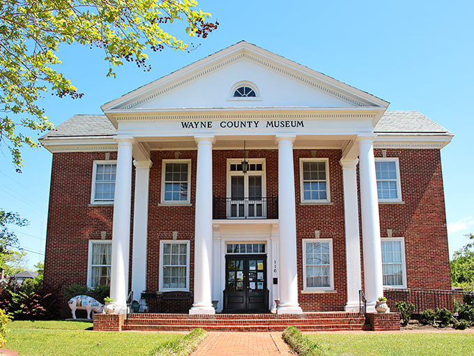 The stately Wayne County Museum stands as a guardian of local history, its classical columns and brick facade inviting visitors to discover the stories that shaped this corner of North Carolina.