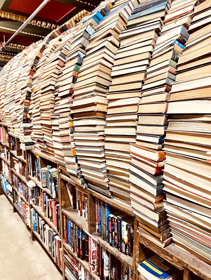 Books stacked with architectural precision create walls of words, pathways of prose, and a labyrinth of literary wonders to get happily lost in.