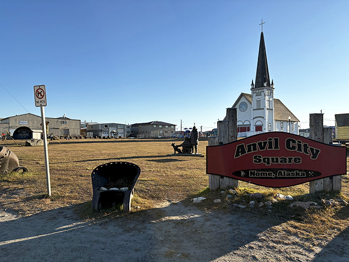 Anvil City Square welcomes visitors with its iconic sign and historic church, where frontier faith meets Arctic resilience.