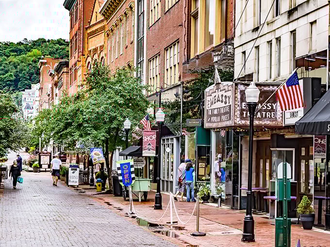 The historic Embassy Theatre marquee stands as a sentinel of culture on Baltimore Street, where small-town charm meets big-city aspirations.