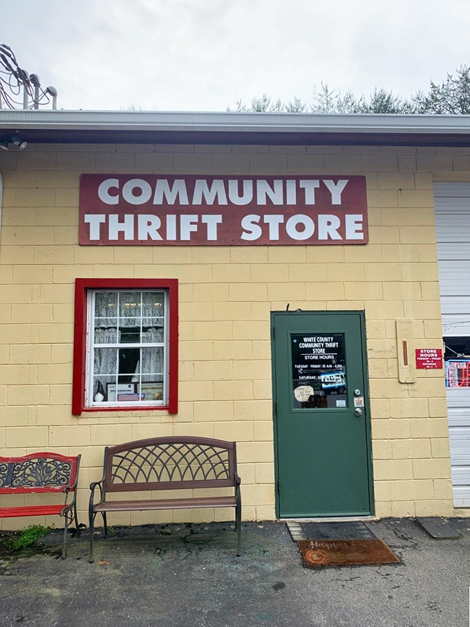 The yellow building with its straightforward signage offers a refreshing honesty. No marketing spin here&mdash;just the promise of affordable treasures.