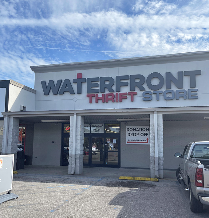 Blue skies and bargains await! The donation drop-off sign hints at the circle of generosity that keeps this thrifting ecosystem thriving.