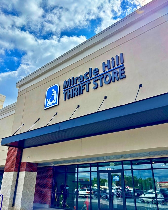 Blue skies and bargains await! The Miracle Hill sign stands as a beacon to thrifty shoppers, like the North Star for budget-conscious explorers.