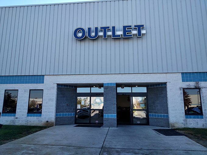 Those blue letters spell opportunity for the thrift-savvy. Behind these doors lies a wonderland where retail rules are suspended and bargains await the bold.