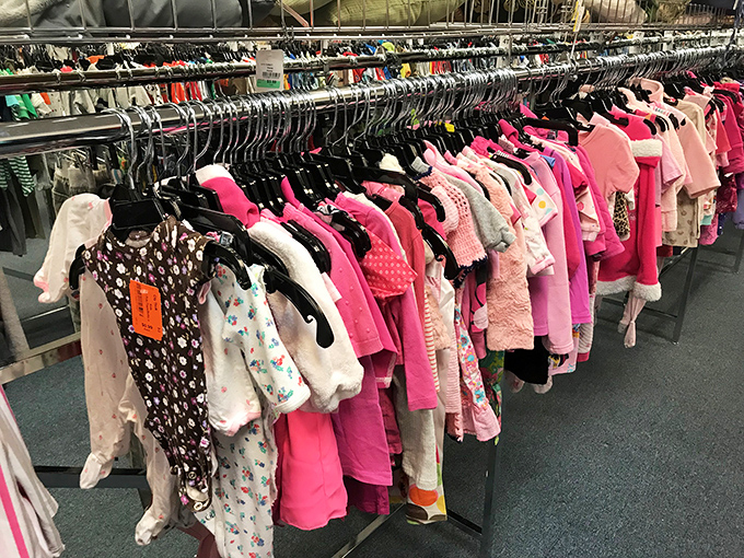 Pink paradise! The children's clothing section bursts with color-coded organization that would make Marie Kondo weep with joy.