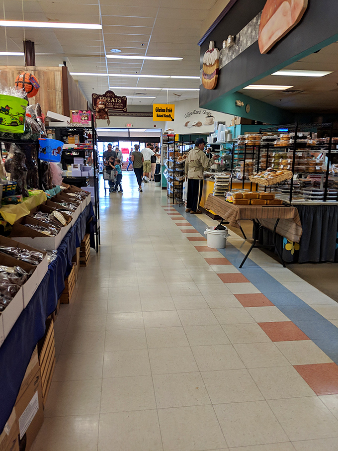 Colorful floor tiles guide hungry explorers through a labyrinth of culinary delights, where every aisle feels like its own delicious neighborhood.