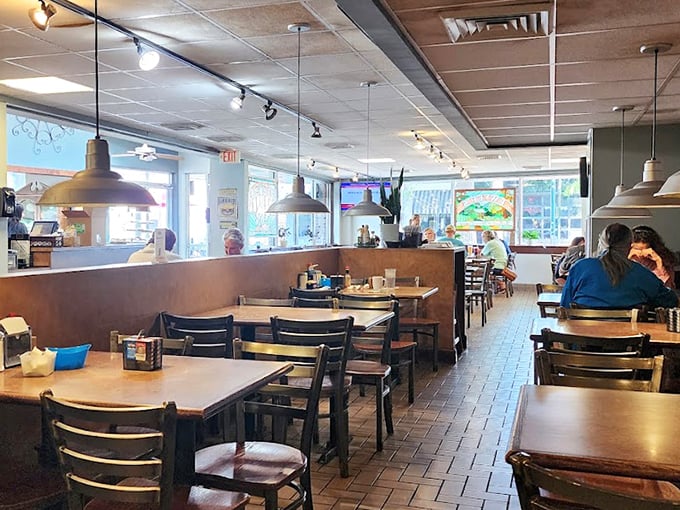 Inside Dwyer's, time slows down as pendant lights cast a warm glow over wooden tables where generations of Louisianians have broken bread together.