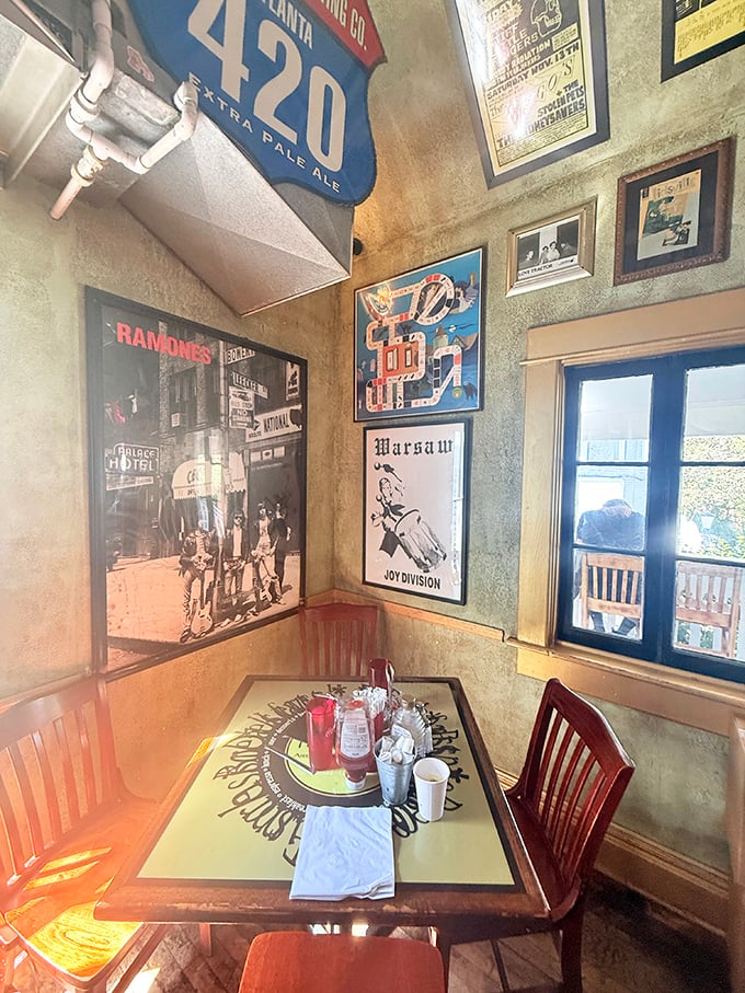 Music posters and hand-painted tables create a dining room that feels like your coolest friend's apartment.