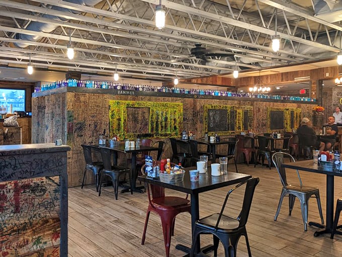Industrial meets homey in this graffiti-adorned dining room. The colorful bottle collection above seems to whisper, "Yes, breakfast can be this exciting."