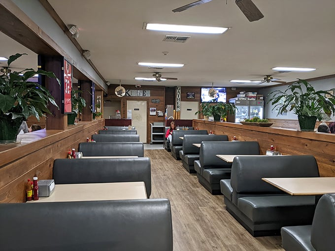 Wood-paneled walls and comfortable booths create the perfect backdrop for serious eating. This isn't Instagram-bait d&eacute;cor&mdash;it's the authentic stage where fried chicken takes its rightful spotlight.