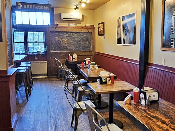 Simple wooden tables and burgundy wainscoting create that perfect "discovered gem" atmosphere&mdash;like walking into your coolest friend's cabin.
