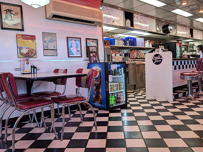 Inside, the classic checkerboard floor and cherry-red vinyl seats aren't just decoration—they're a declaration that you've entered the promised land of American diner culture.