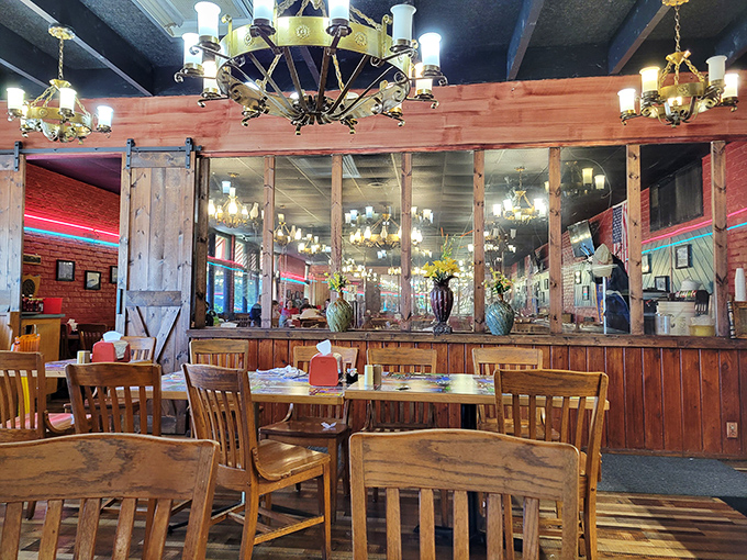 Rustic wooden charm meets homestyle comfort in Barnhill's dining room. Those chandeliers aren't just for show—they're spotlights illuminating Arkansas's buffet hall of fame.