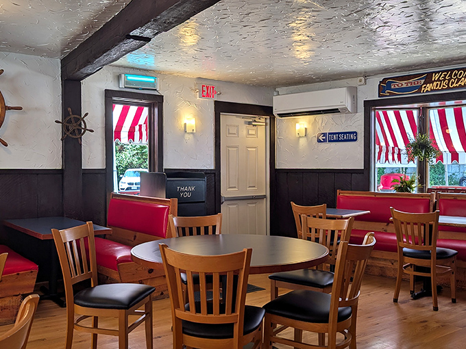 Nautical charm meets no-nonsense comfort inside, where red vinyl booths have witnessed decades of seafood euphoria and napkin-dabbed butter chins.