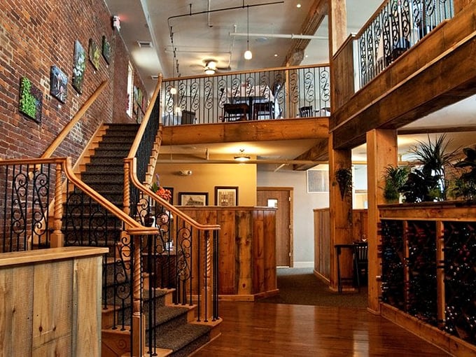 The interior's marriage of rustic charm and elegant design creates an atmosphere that whispers "special occasion" while still saying "make yourself at home."