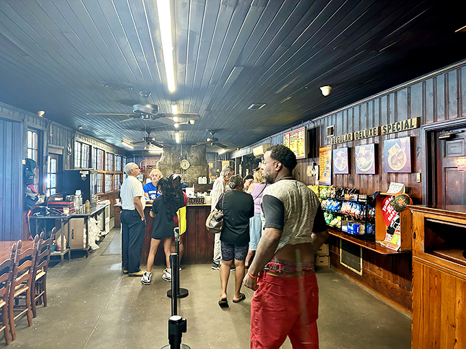 Inside, time stands still as ceiling fans lazily push around the intoxicating aroma of hickory smoke and Southern hospitality.