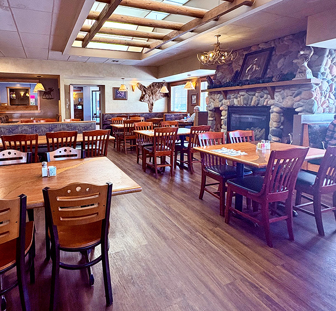 Rustic wooden beams, stone fireplace, and comfortable seating create the perfect backdrop for the food magic that happens at Sunset Cafe.