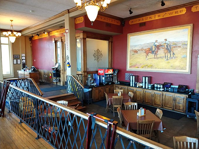 Split-level dining with western artwork and wooden railings creates an atmosphere that's both rustic and refined&mdash;Texas elegance without the pretension.