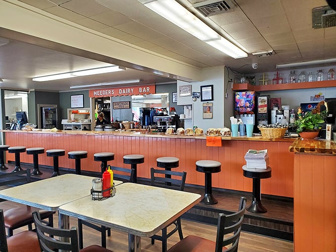 Inside, the salmon-colored counter and classic swivel stools transport you to a time when conversations happened face-to-face, not screen-to-screen.