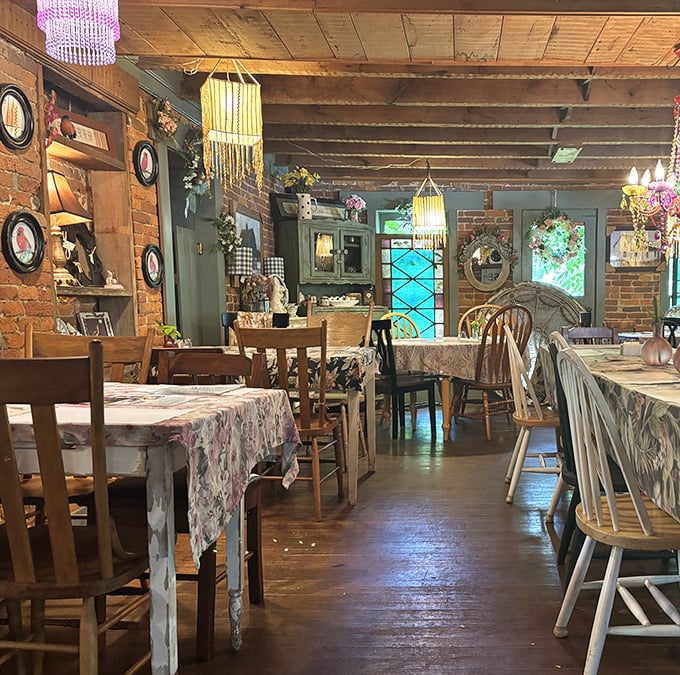 Mismatched chairs, floral tablecloths, and exposed brick walls create the feeling you've stumbled into your stylish grandmother's secret dining room.