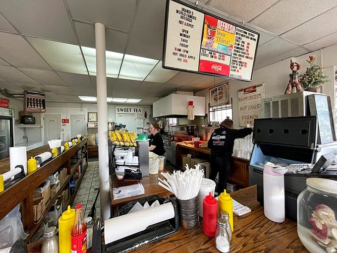 Classic counter service where condiment bottles stand at attention, ready to customize your meal to perfection.