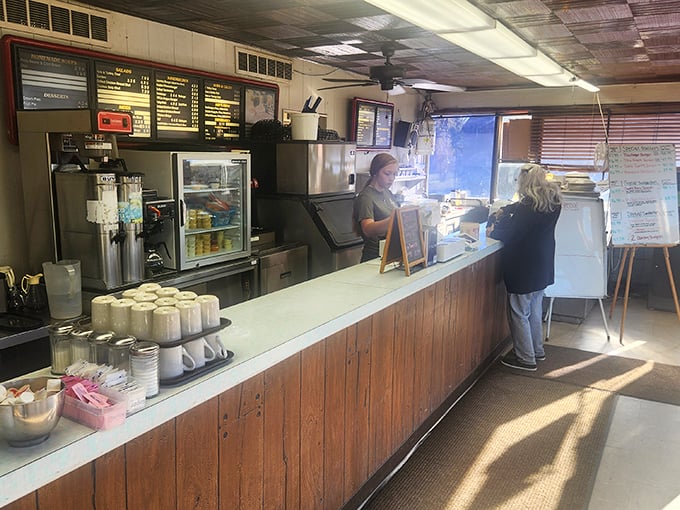 Where magic happens behind wooden counters worn smooth by decades of service. The handwritten specials board speaks volumes about priorities: food first, fancy never.