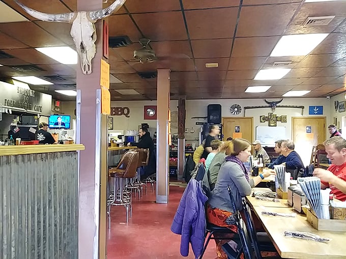 Inside, where cattle skulls watch over diners and conversations flow as freely as the coffee. The counter seats offer front-row tickets to the culinary show.