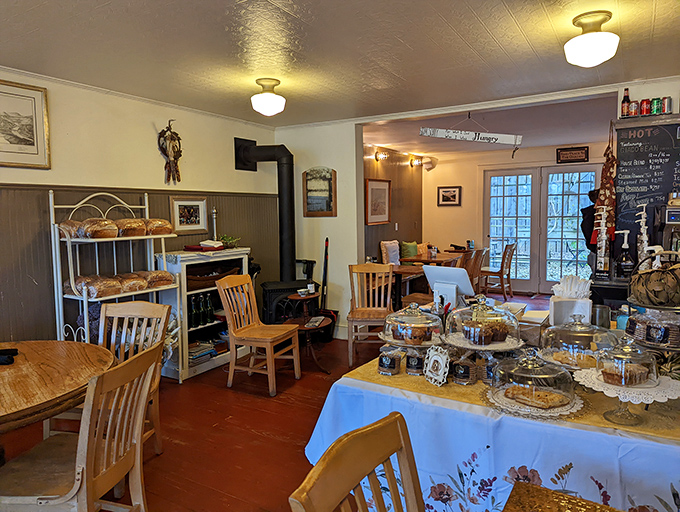 Inside, time slows down as wooden chairs, vintage displays, and glass-domed pastries create the living room you wish you had.