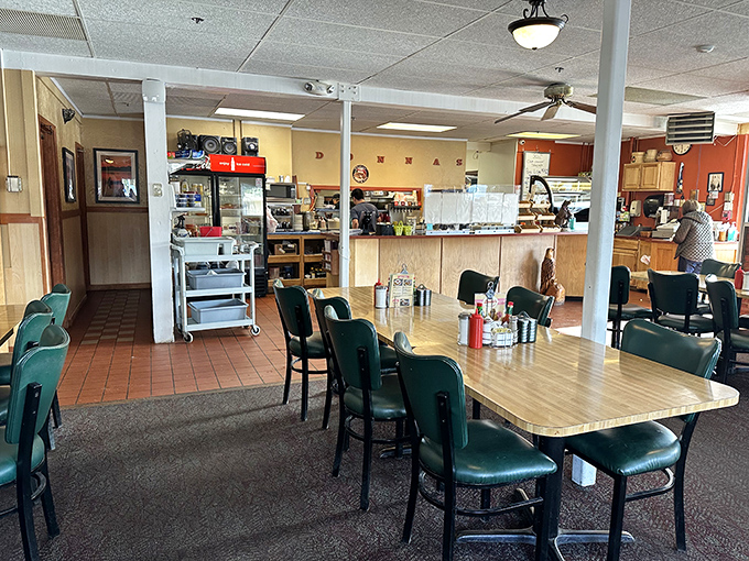 Classic diner charm at its finest&mdash;wooden tables, green chairs, and the promise of honest-to-goodness comfort food that makes you feel instantly at home.