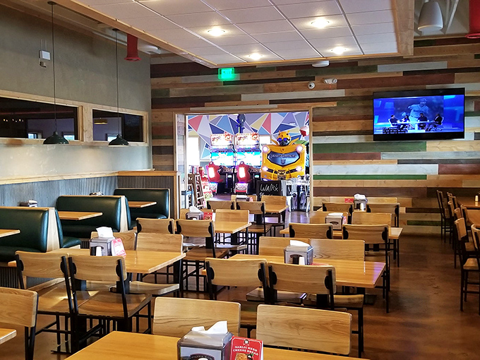 Modern rustic meets Montana casual in this inviting dining space where wooden tables await your pizza dreams and arcade adventures.