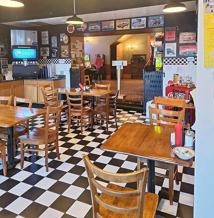Classic black and white checkered floors set the stage for wooden tables where countless conversations have unfolded over steaming cups of coffee and hearty breakfasts.