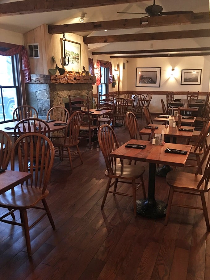 Rustic wooden beams, Windsor chairs, and a stone fireplace create the perfect maritime-meets-mountain ambiance where seafood dreams come true far from any coastline.