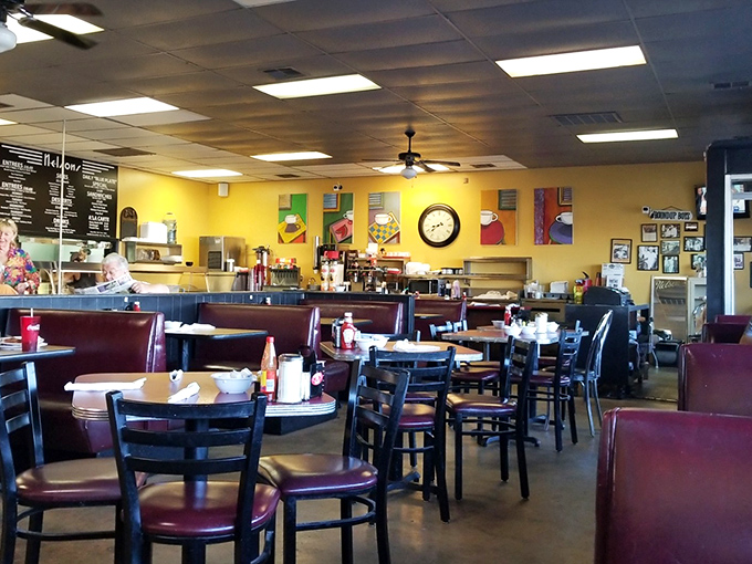 Yellow walls, burgundy booths, and the quiet hum of conversation &ndash; the interior design equivalent of a warm hug.