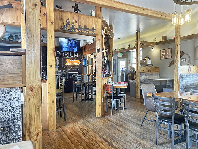 Rustic wooden beams frame this cozy dining space like a hug from an old friend. The mason jar lights cast just enough glow to make everyone look like they've made good life choices.