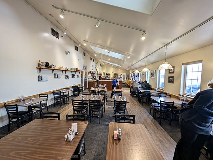 Bright skylights illuminate wooden tables where Fairbanks locals gather. The dining room feels like Alaska itself&mdash;spacious yet cozy, with room for everyone's stories.