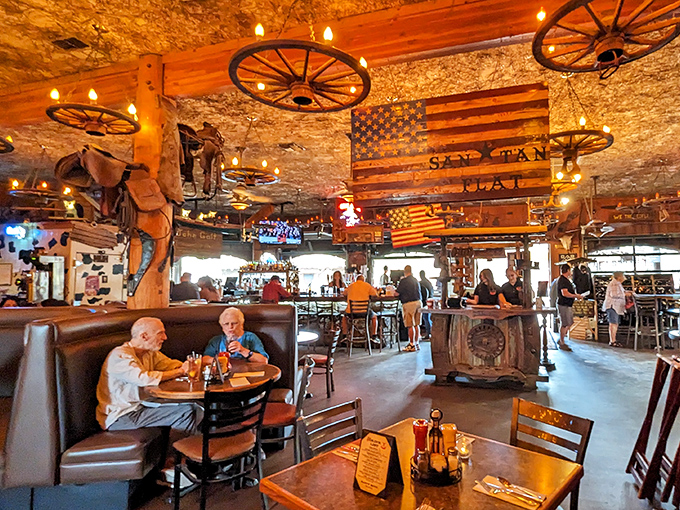 Wagon wheels overhead, American flags on display, and enough Western charm to make John Wayne feel right at home. The dining room buzzes with conversation and anticipation.