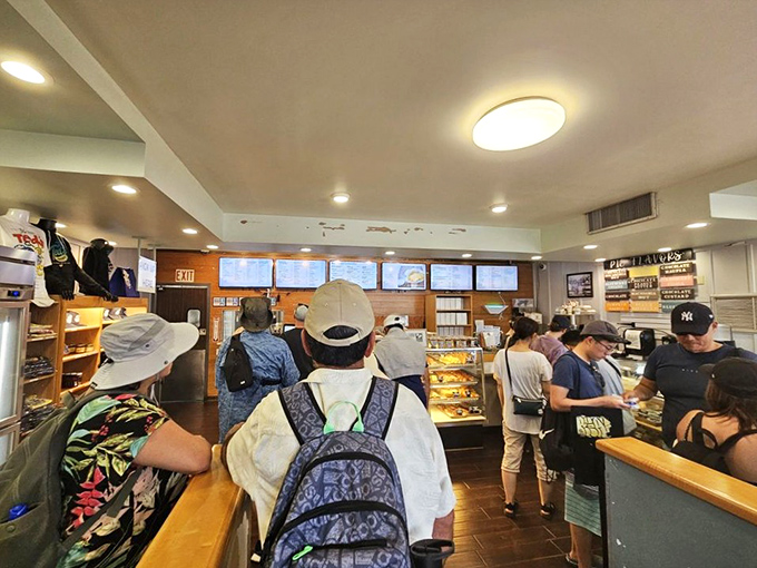Inside, the bakery buzzes with anticipation as hungry patrons eye the display cases, mentally calculating how many slices they can reasonably consume in one sitting.