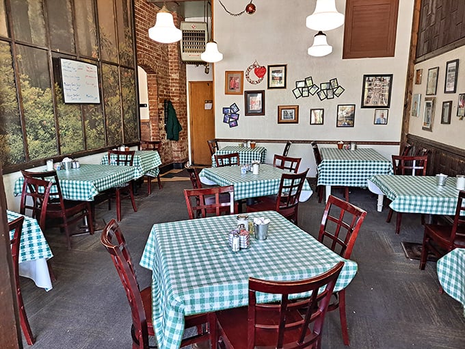 Classic green checkered tablecloths and wooden chairs create that "grandma's kitchen" vibe where calories don't count and coffee refills are practically mandatory.