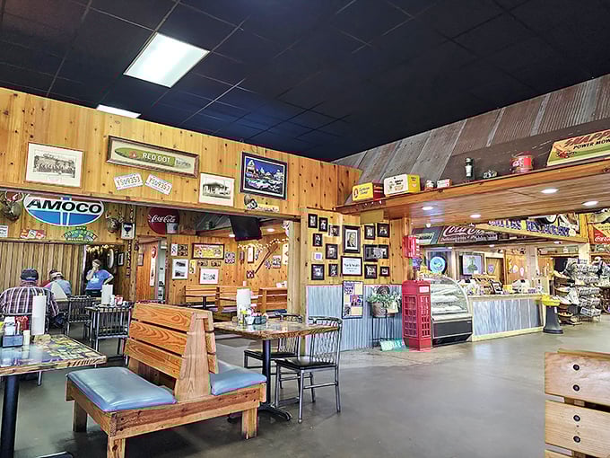 Wood-paneled walls adorned with vintage memorabilia create a museum of Americana where every Coca-Cola sign and knickknack tells a story while you feast.