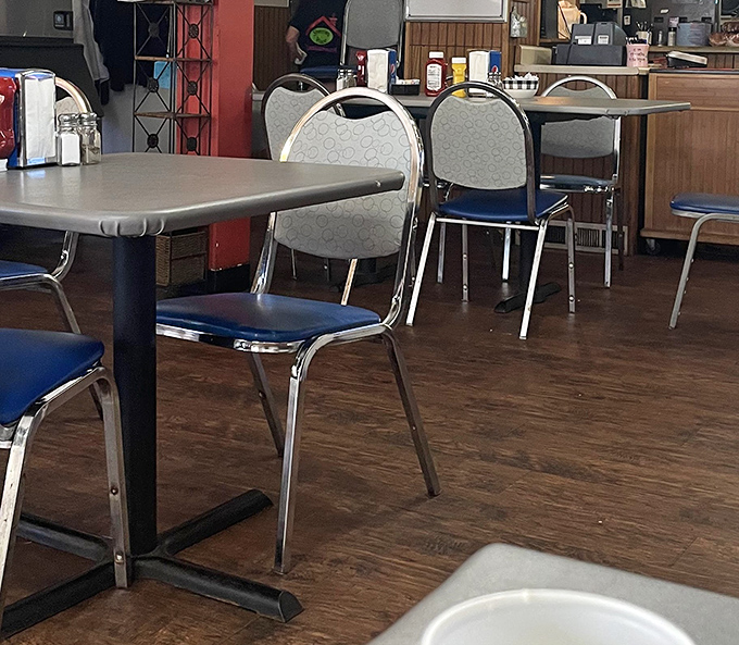 Classic blue vinyl chairs and simple tables create the perfect stage for breakfast theater&mdash;no fancy design needed when the food steals the show.