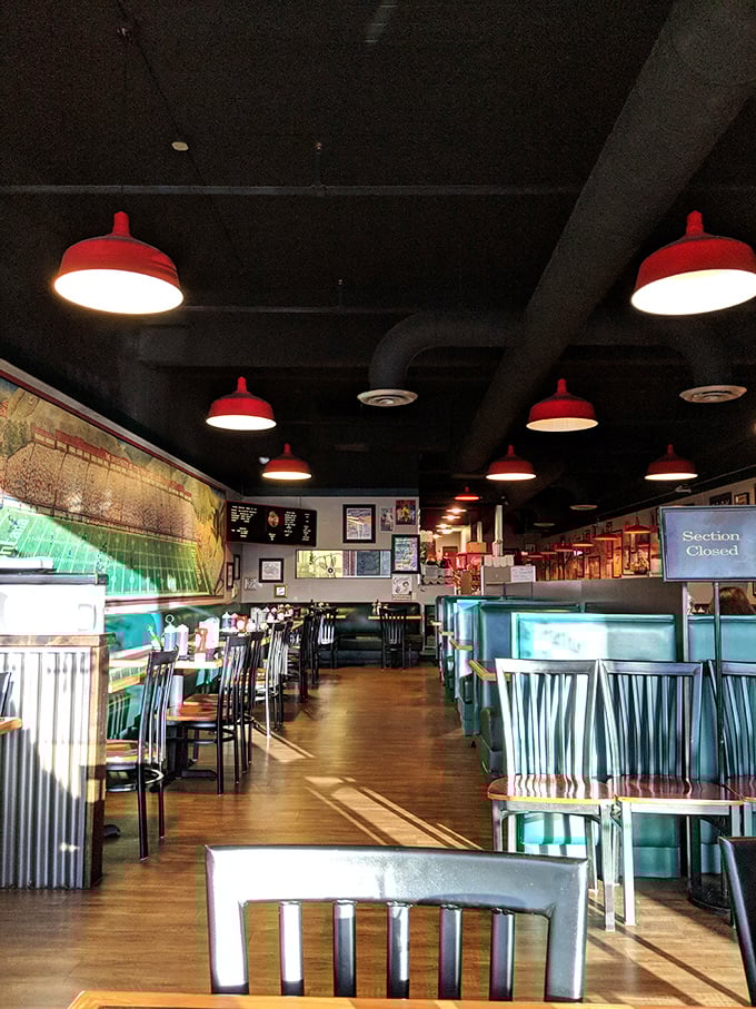Retro charm meets breakfast comfort. The turquoise booths and red pendant lights create the perfect backdrop for morning magic.